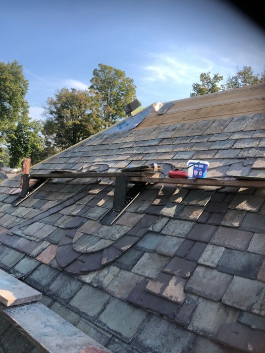 Slate roof with inscription, copper standing seam details. – Trad Building
